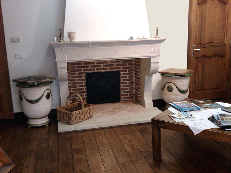 French Provincial stone fireplace surrounds and mantels